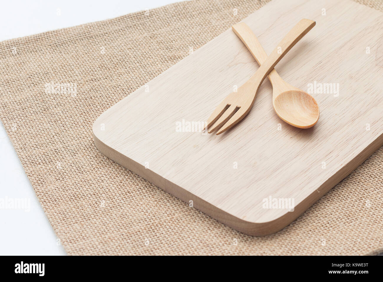 wood plate for serving food and wood spoon and fork Stock Photo - Alamy