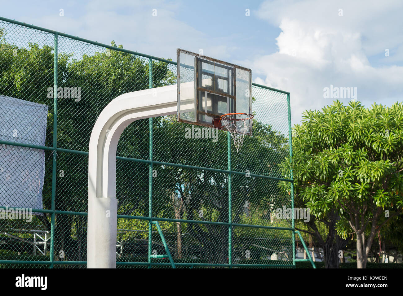 Basketball backboard at outdoor basketball court on a nice sunny day ...