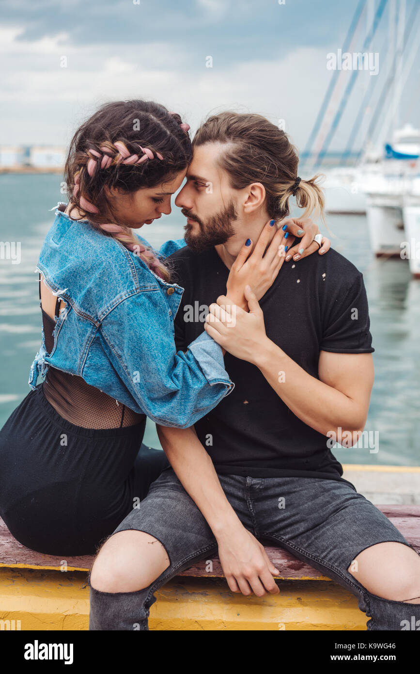 Guy and girl on pier Stock Photo - Alamy