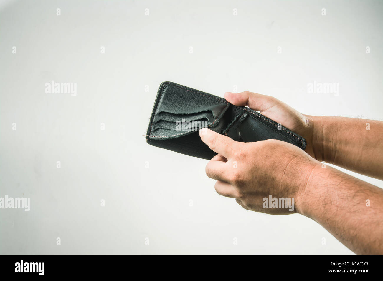 wallet in hand on white background Stock Photo - Alamy