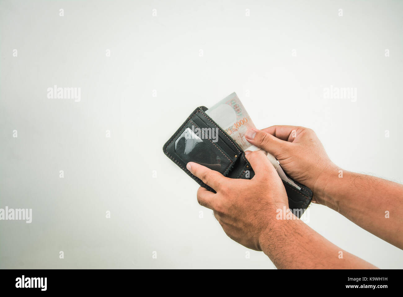wallet in hand on white background Stock Photo - Alamy