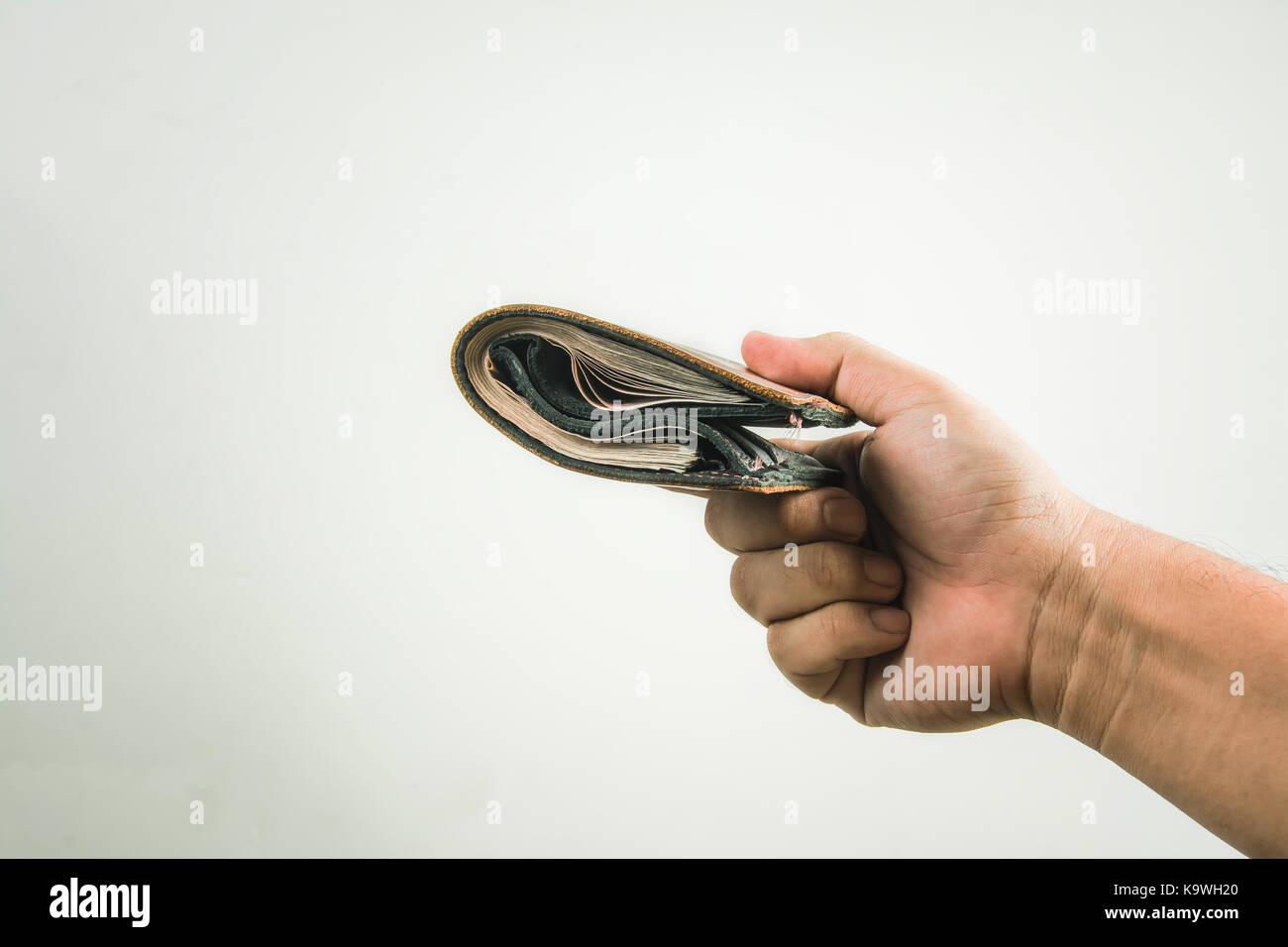 wallet in hand on white background Stock Photo - Alamy