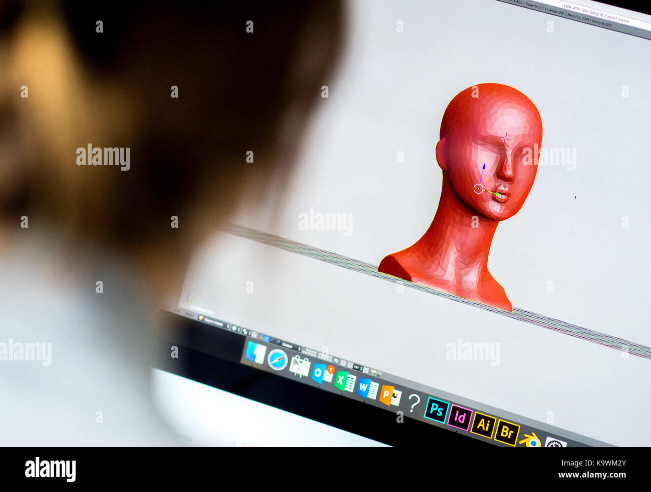 An employee of the company Genesis Display edits a 3D model of a female ...