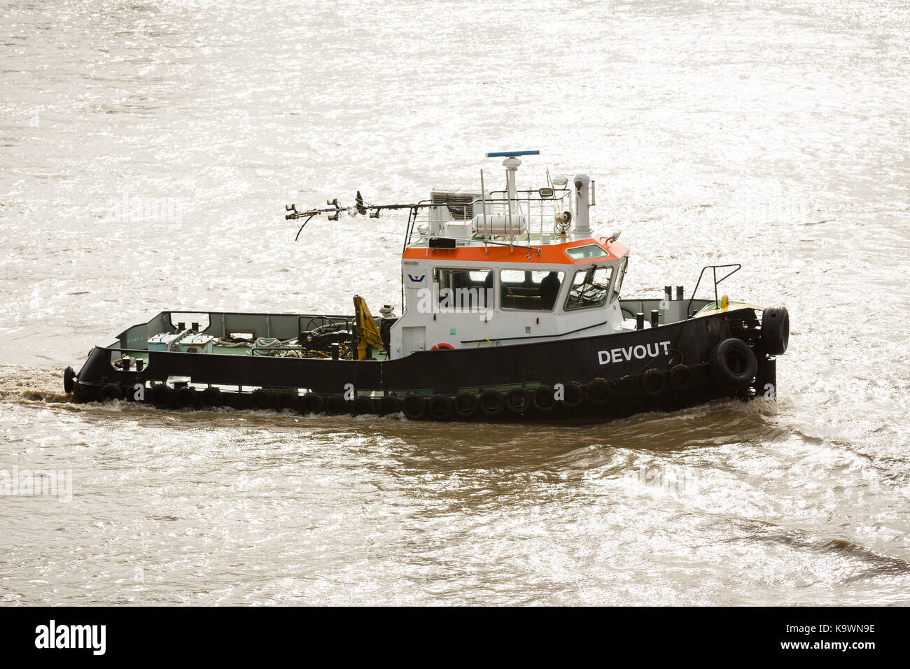 London, UK. 23rd September 2017. Tug 'Devout' assists the historic ...