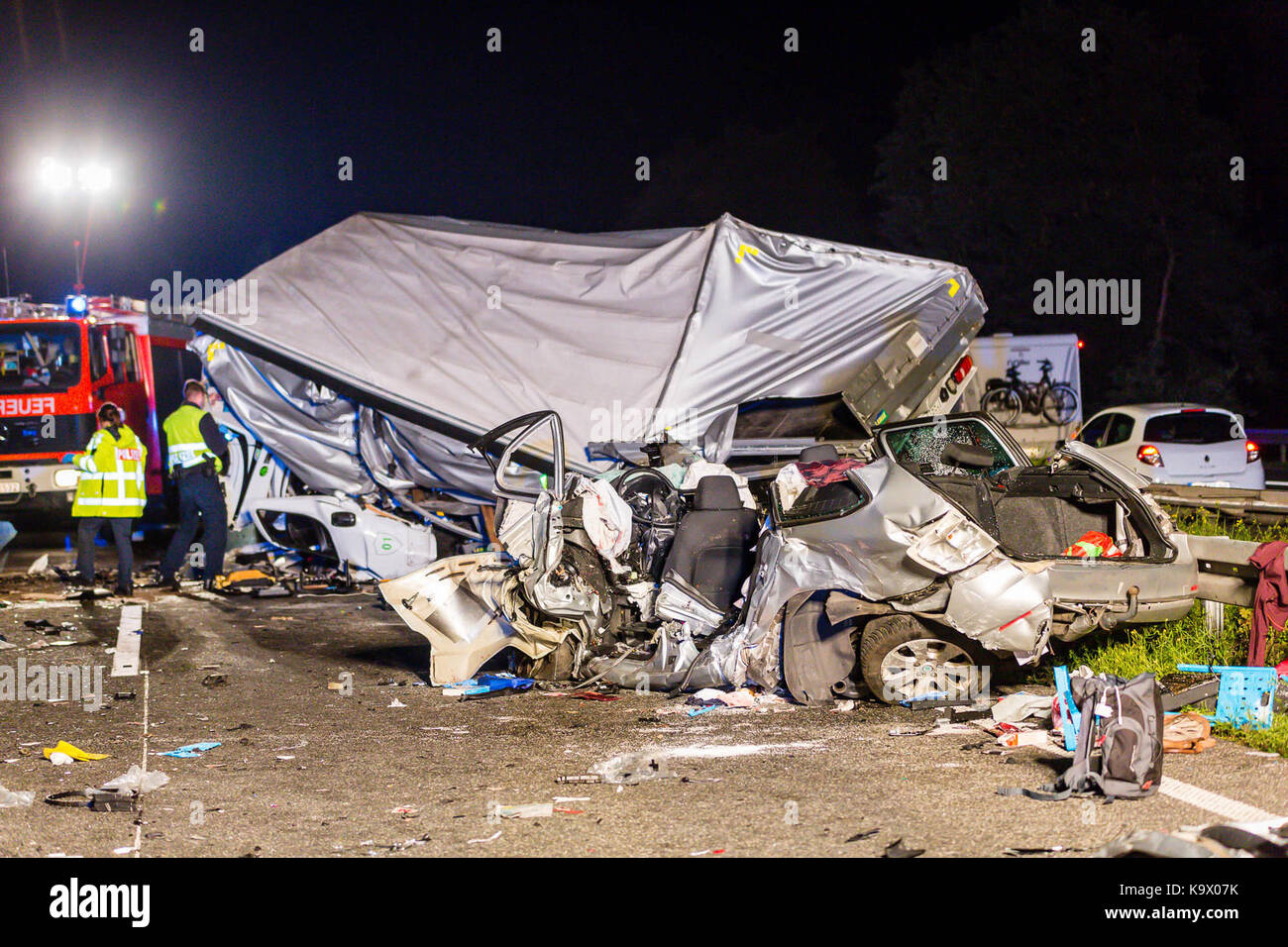 A smaller car can be seen after a deadly traffic accident involvong a ...