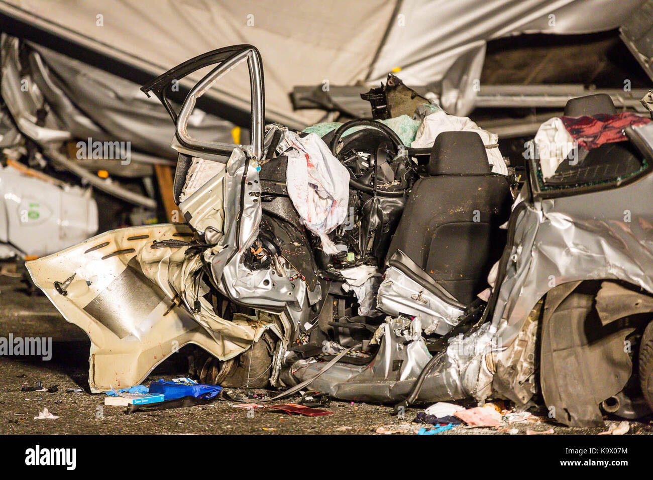 A smaller car can be seen after a deadly traffic accident involvong a ...