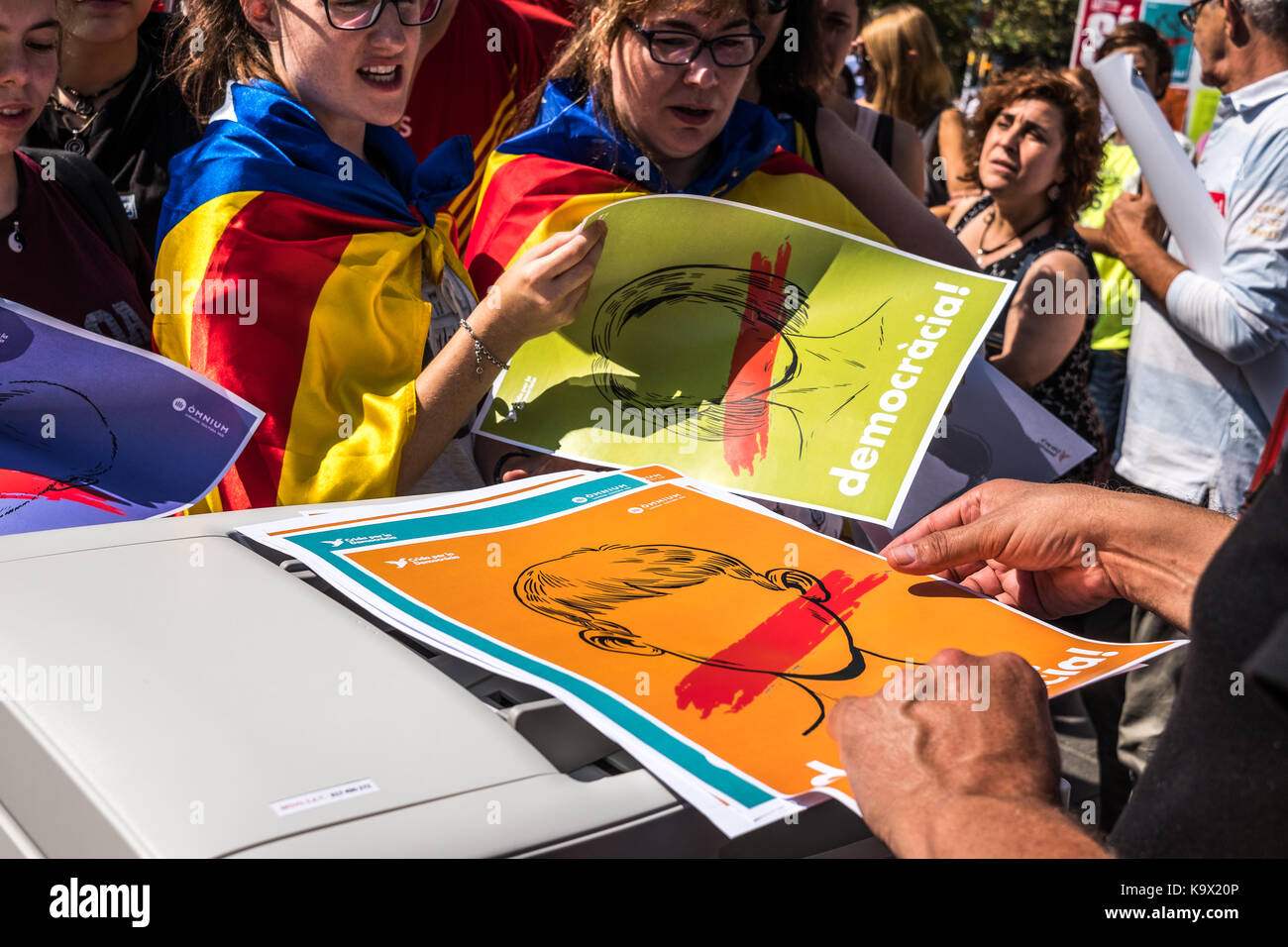 Pro referendum participants are seen collecting posters from the ...