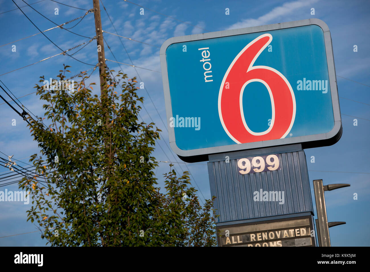 A logo sign outside of a Motel 6 location in Frederick, Maryland on ...