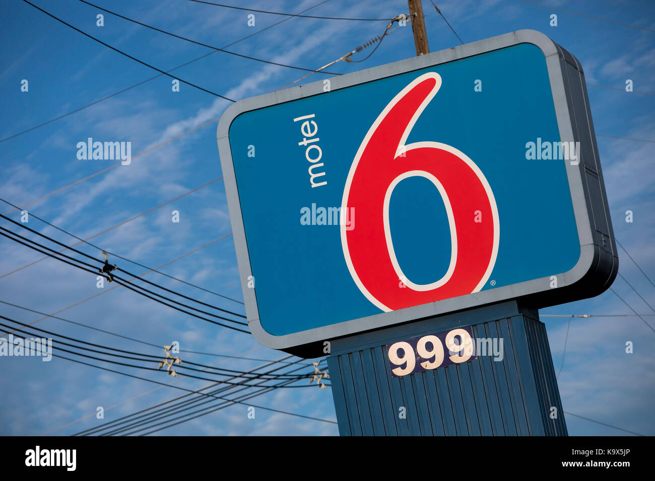 A logo sign outside of a Motel 6 location in Frederick, Maryland on ...