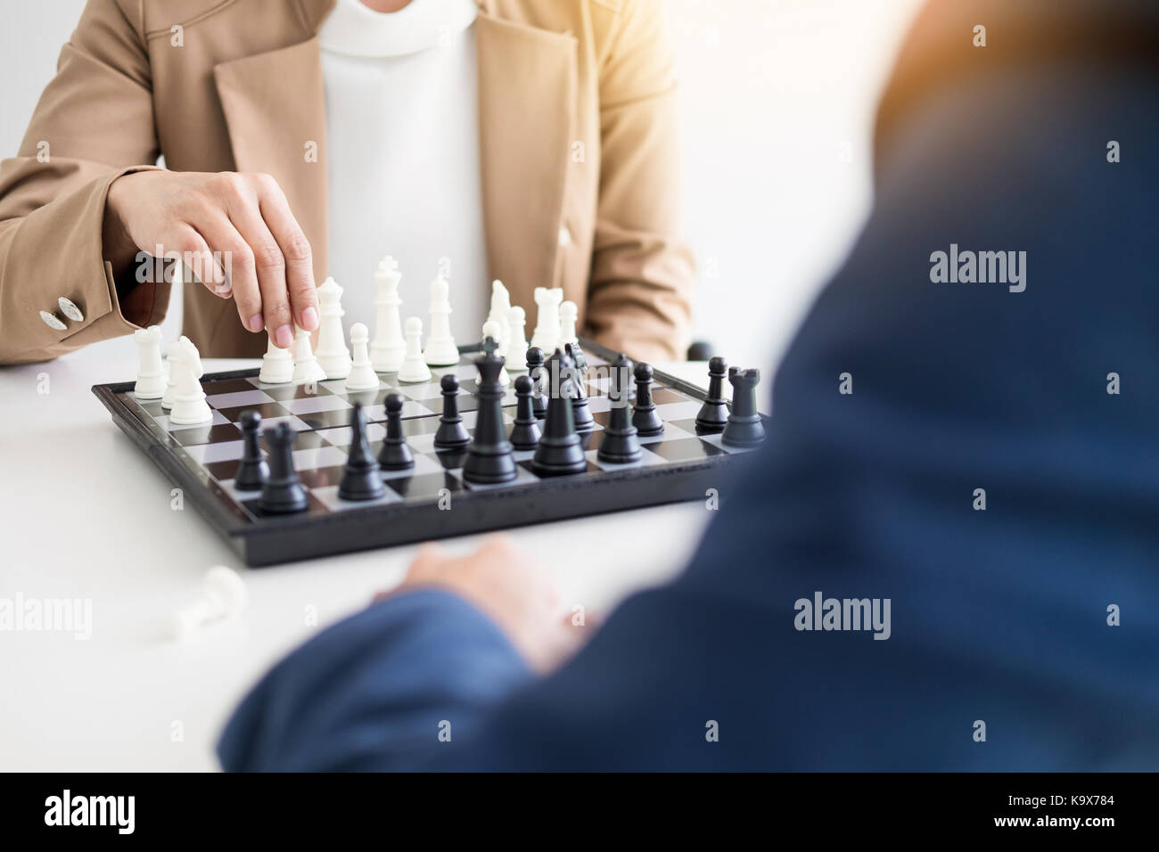 two businessmen thinking Strategy of move while playing chess concept ...