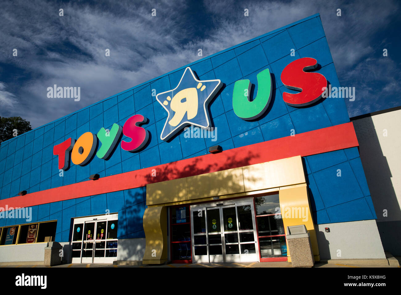 A logo sign outside of a Toys "R" Us retail store in Frederick ...
