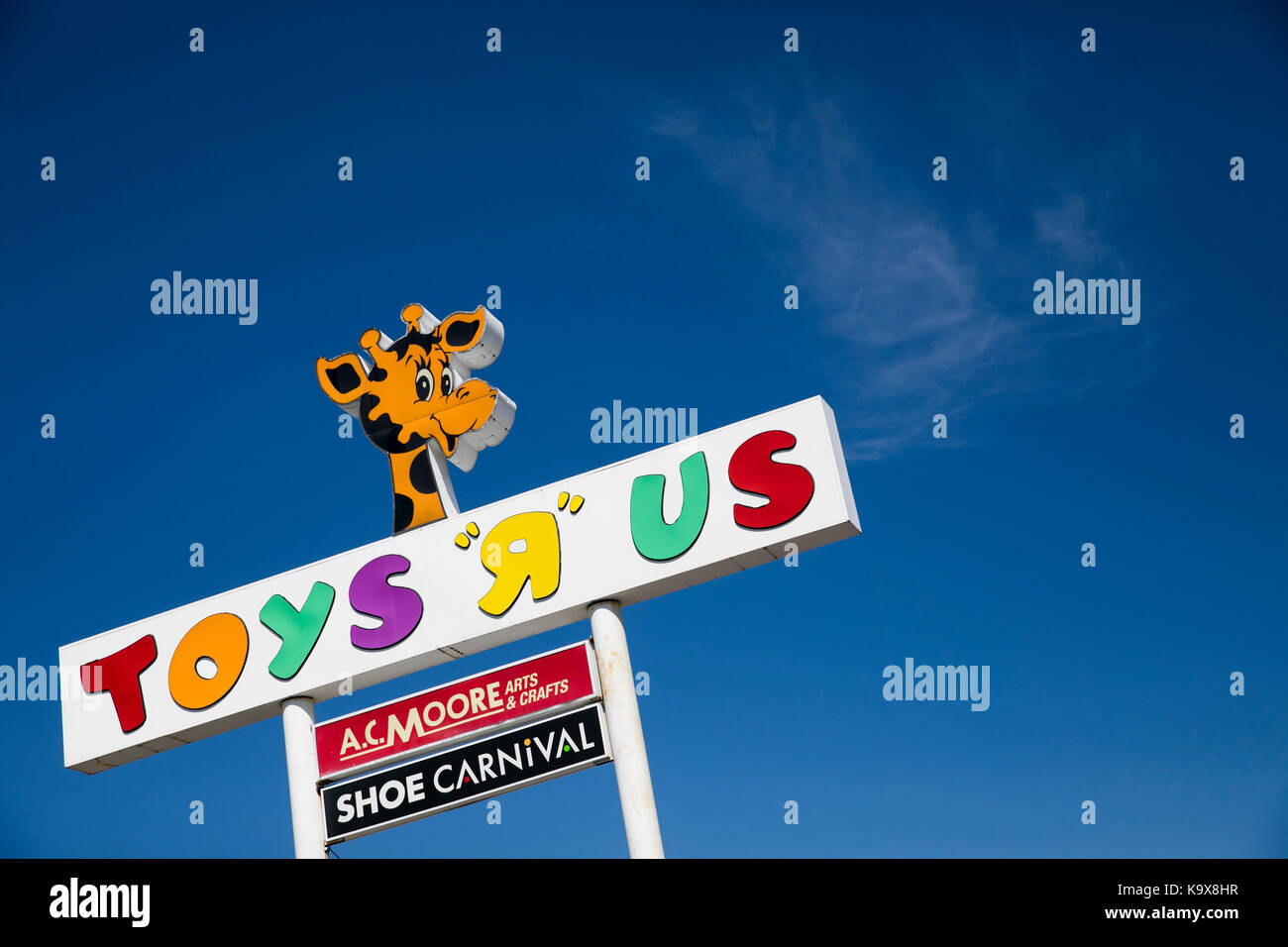 A logo sign outside of a Toys "R" Us retail store in Altoona ...