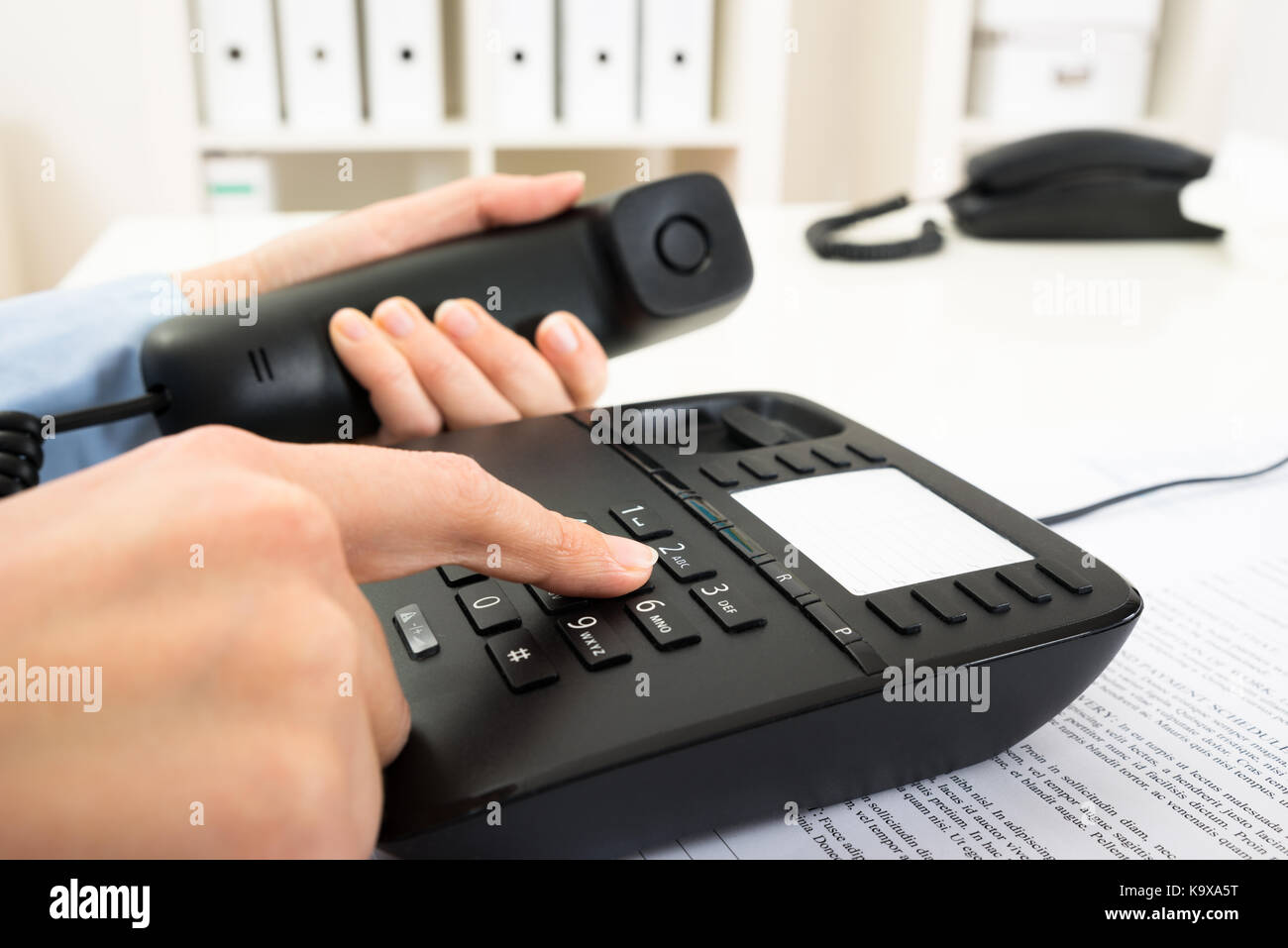 Close-up Of Businessperson Dialing Number On Telephone Keypad Stock ...