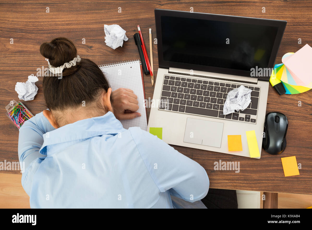 Woman with head down on desk hi-res stock photography and images - Alamy