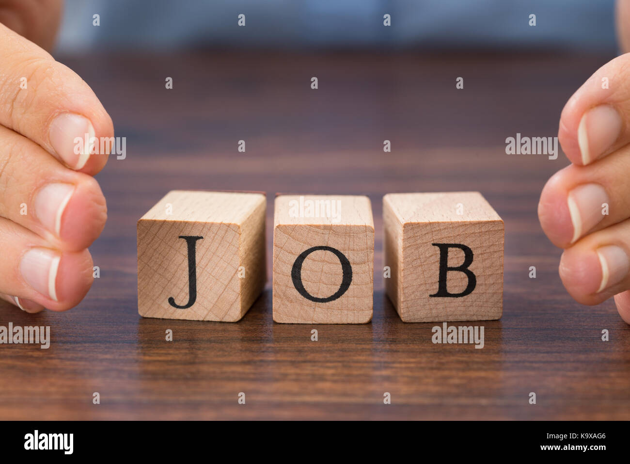 Close-up Of Person Hand Saving Wood Blocks With The Word Job Stock ...