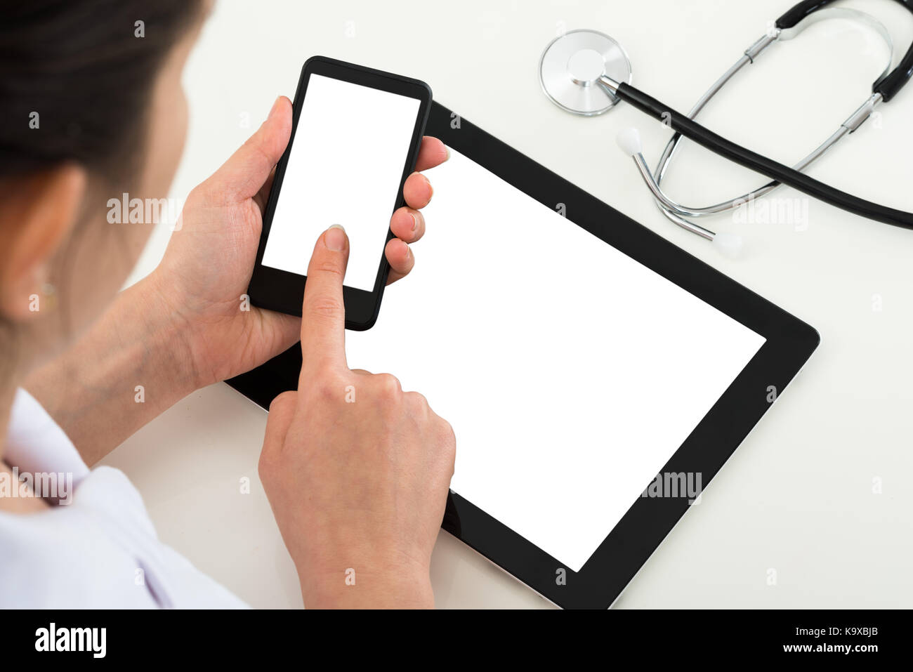 Close-up Of Doctor Using Blank Display Mobile Phone With Digital Tablet ...