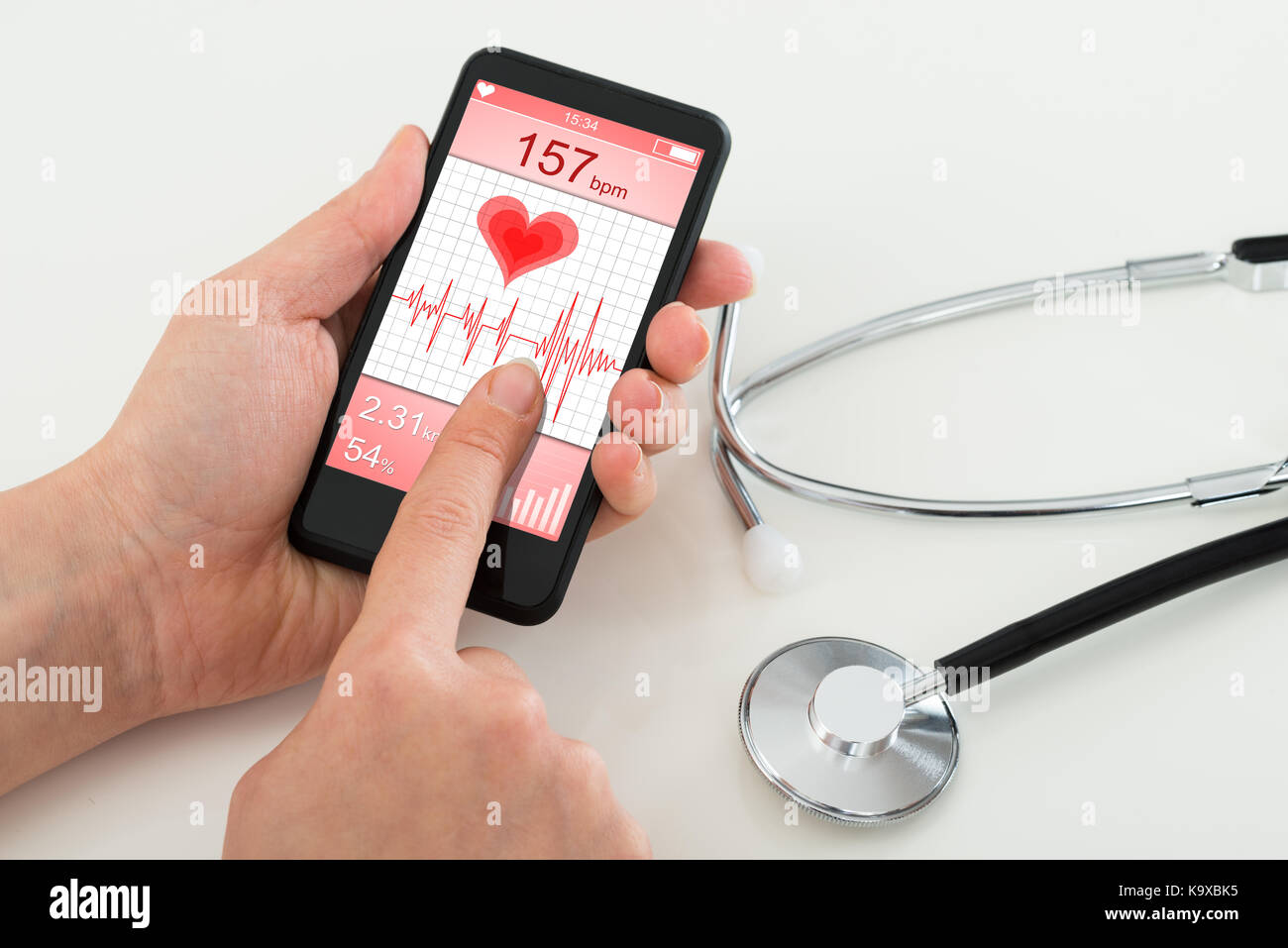 Close-up Of Person Hand With Mobile Phone Showing Heart Pulse Rate ...