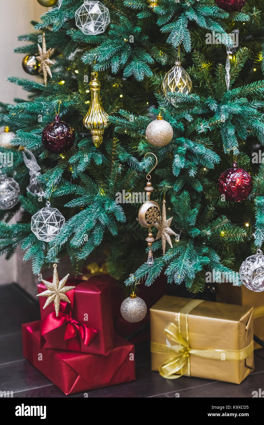 Beautiful boxes with gifts under a decorated Christmas tree Stock Photo ...