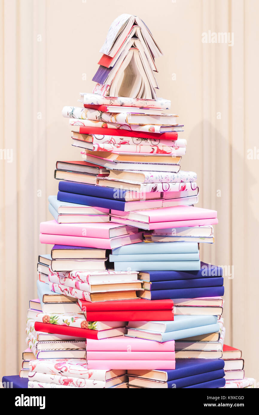 Unusual Christmas tree from the pile of books Stock Photo - Alamy