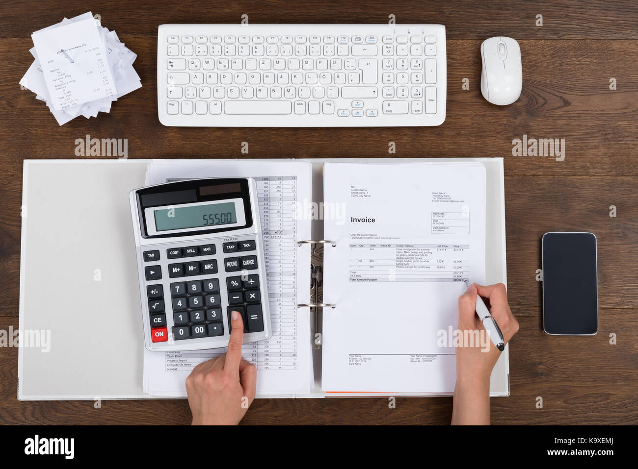 High Angle View Of Person Hands Calculating Invoice With Calculator ...