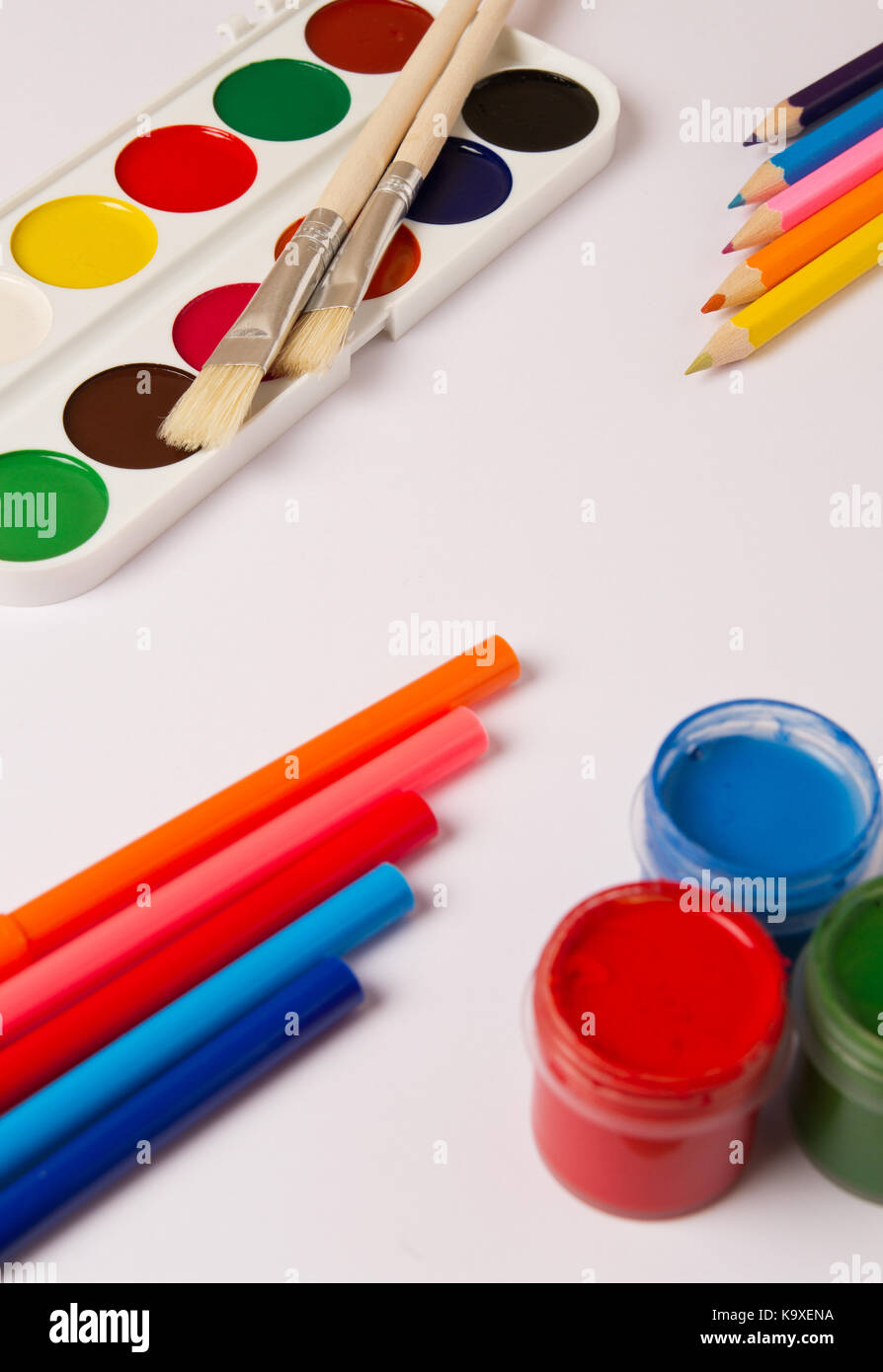Drawing tools on white paper Stock Photo - Alamy