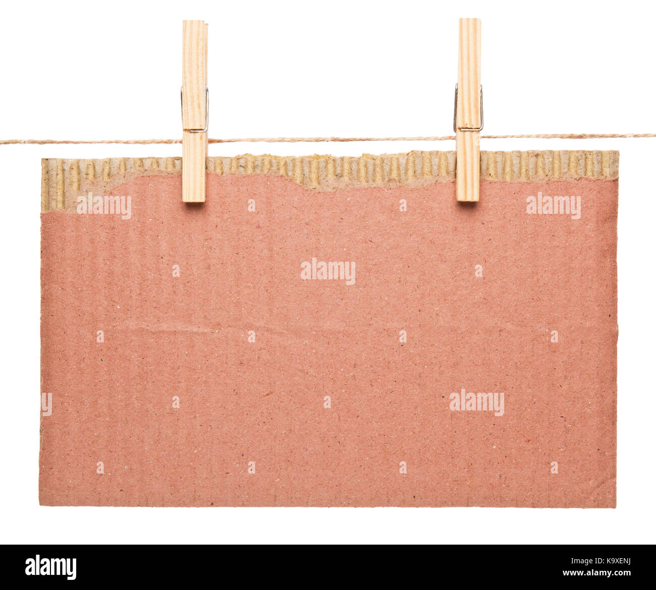 Cardboard paper on rope isolated on white background Stock Photo - Alamy