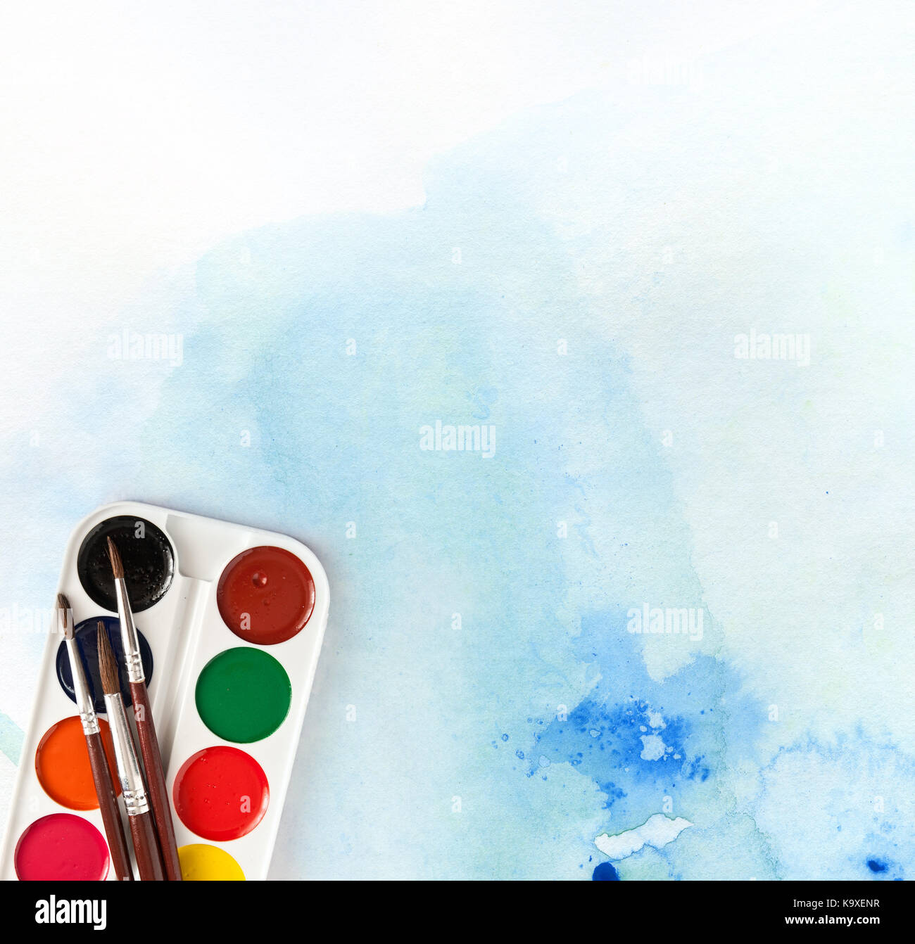 Painting tools on abstract watercolor painting Stock Photo - Alamy