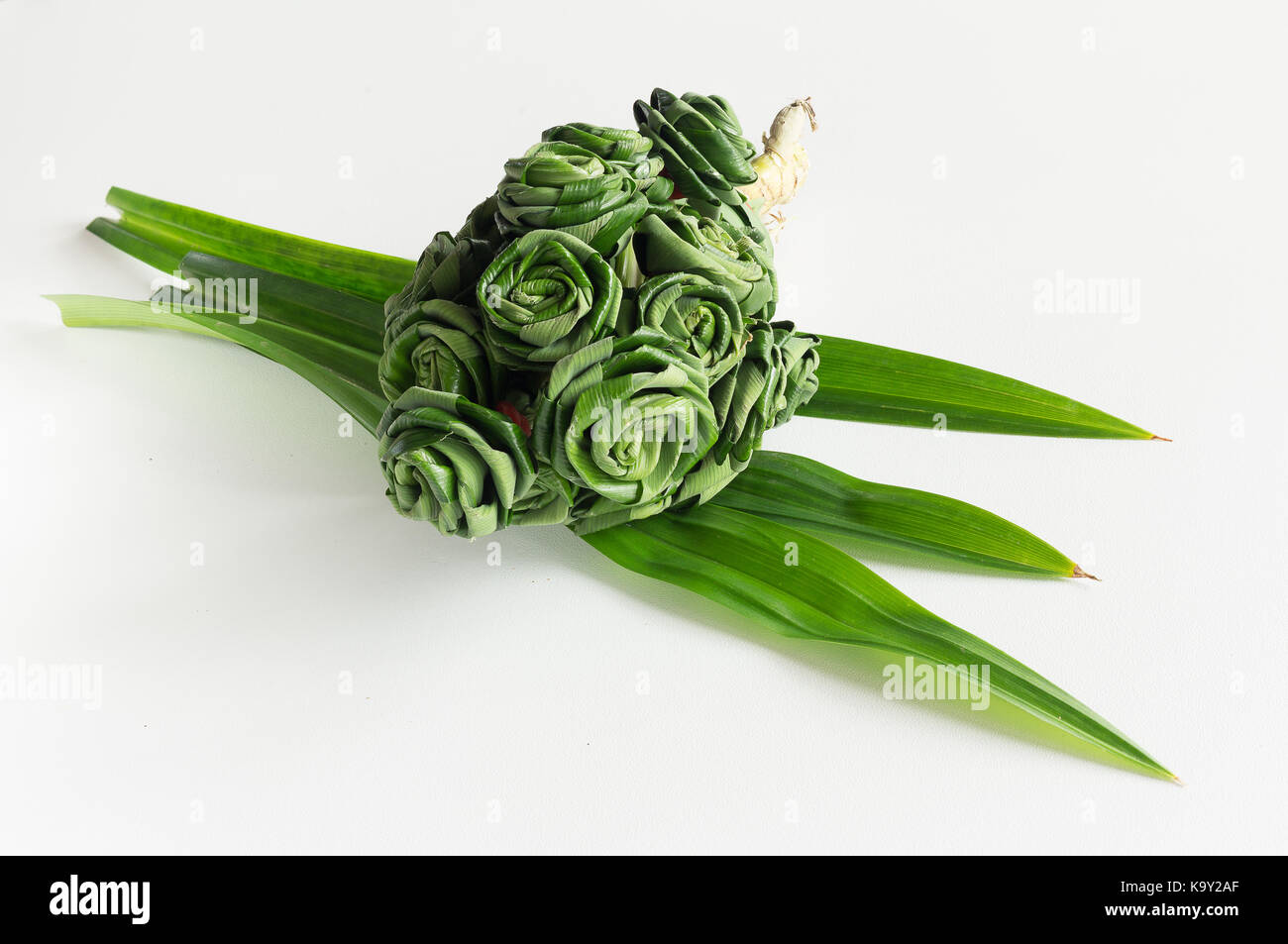 Fresh Pandanus leaf weave to rose bouquet on white background Stock ...