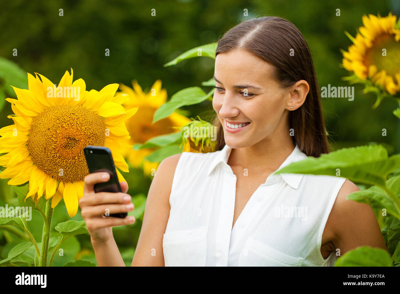 Happy young woman calling by phone. Close up portrait of beautiful ...