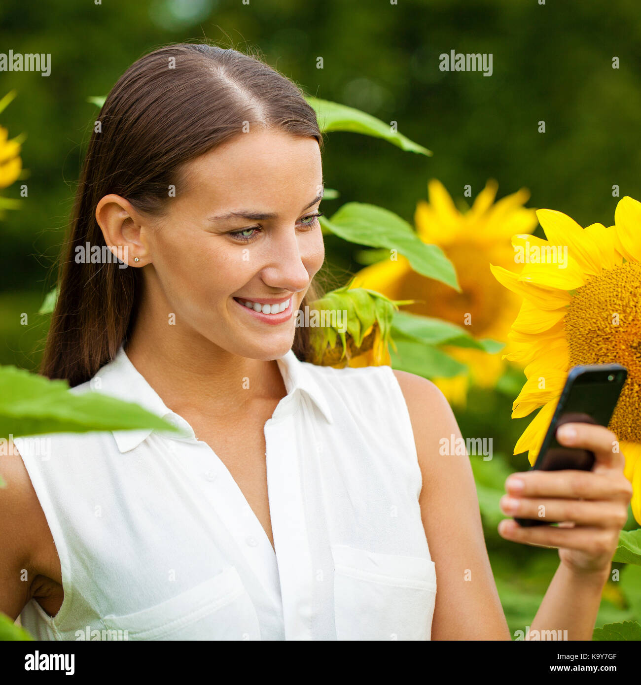 Happy young woman calling by phone. Close up portrait of beautiful ...
