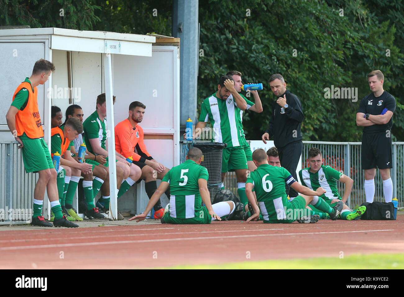 Whitton United manager Shane Coldron gives his half-time team talk by ...
