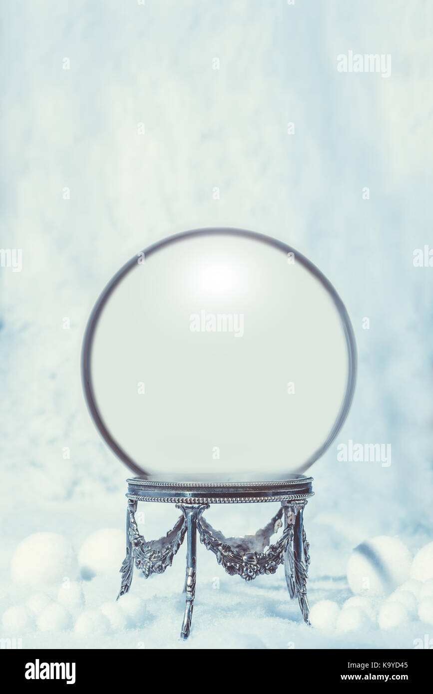Empty snow globe on an antique silver stand in snowfall for Christmas ...