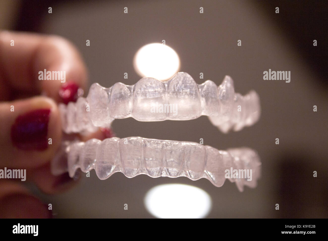 Invisible orthodontics for aligning teeth Stock Photo - Alamy