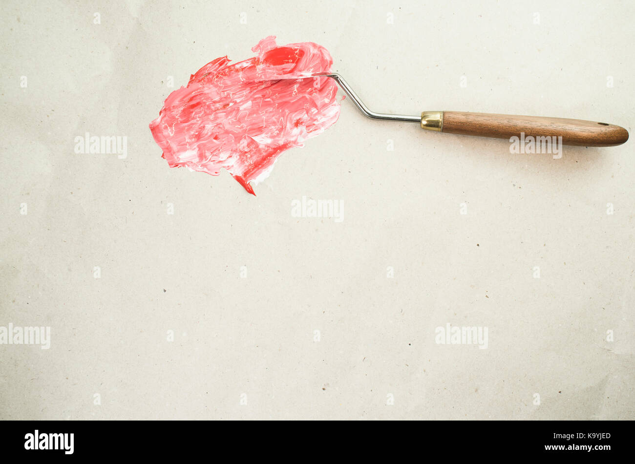 poster paint and spatula on a paper surface - directly above Stock ...