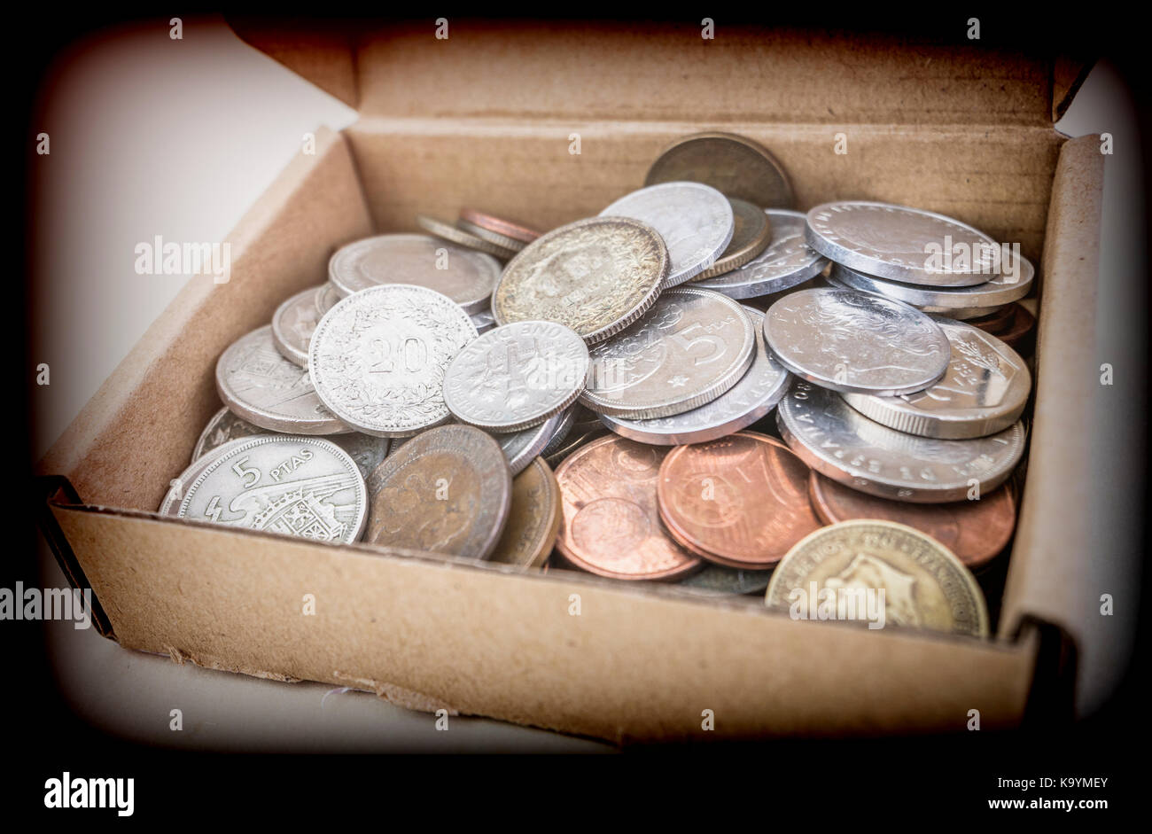 Cardboard box full of ancient coins Stock Photo - Alamy