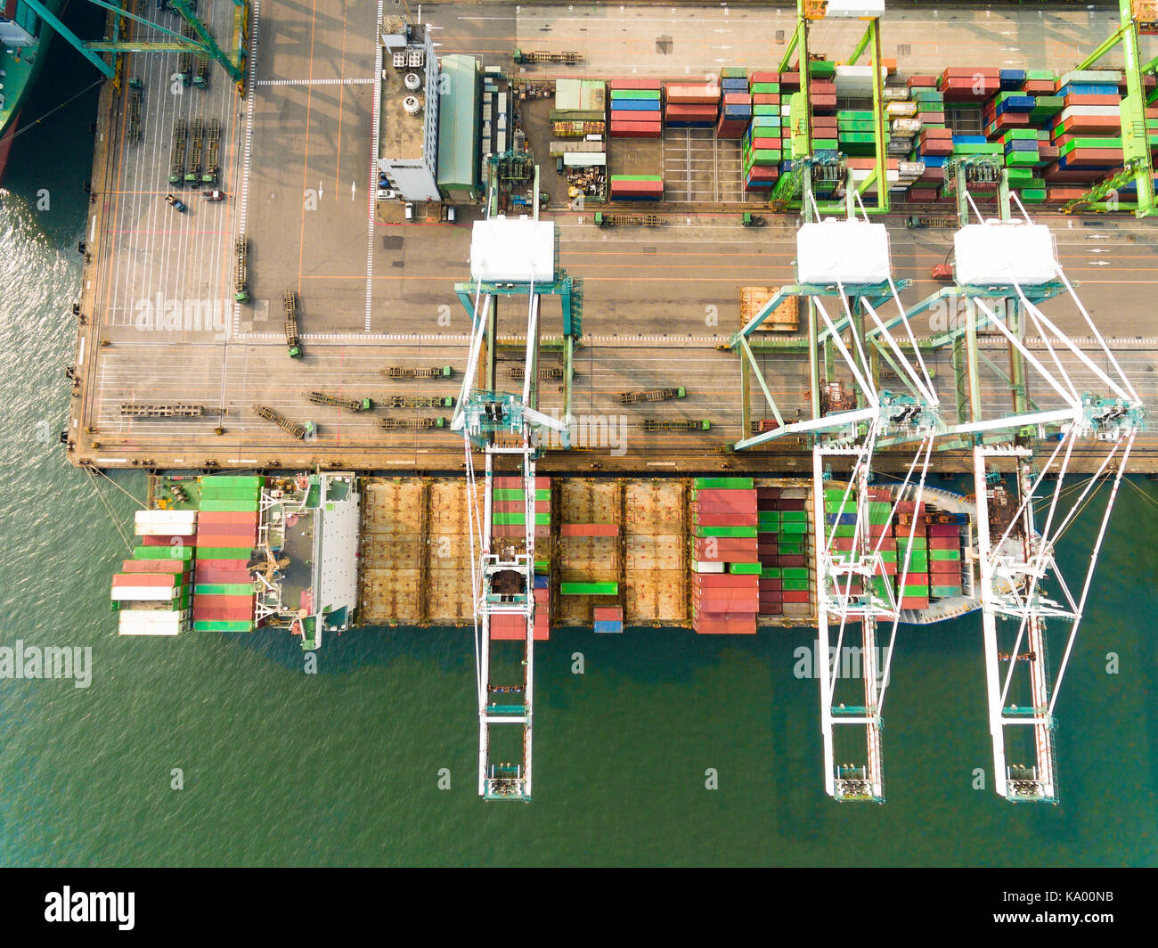 Aerial view of cargo dock and Container Ship Stock Photo - Alamy