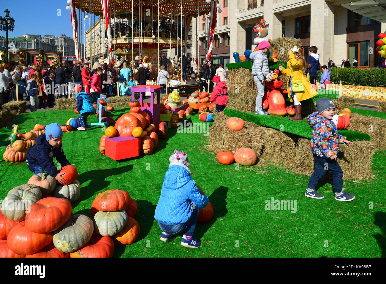 Moscow, Russia - September 23. 2017. Children play around carousel on ...