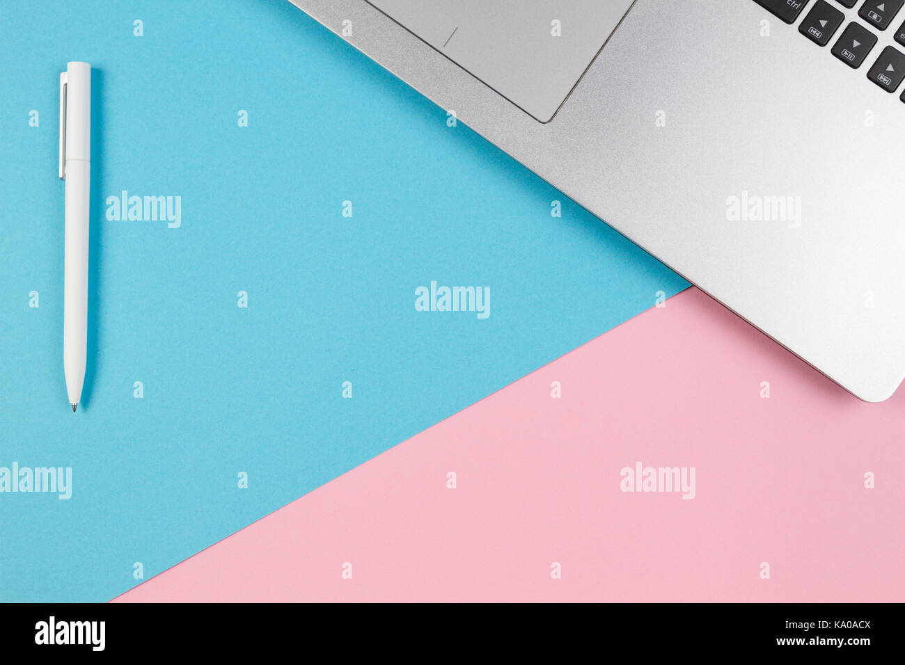 Top view of laptop notebook on blue and pink color background Stock ...