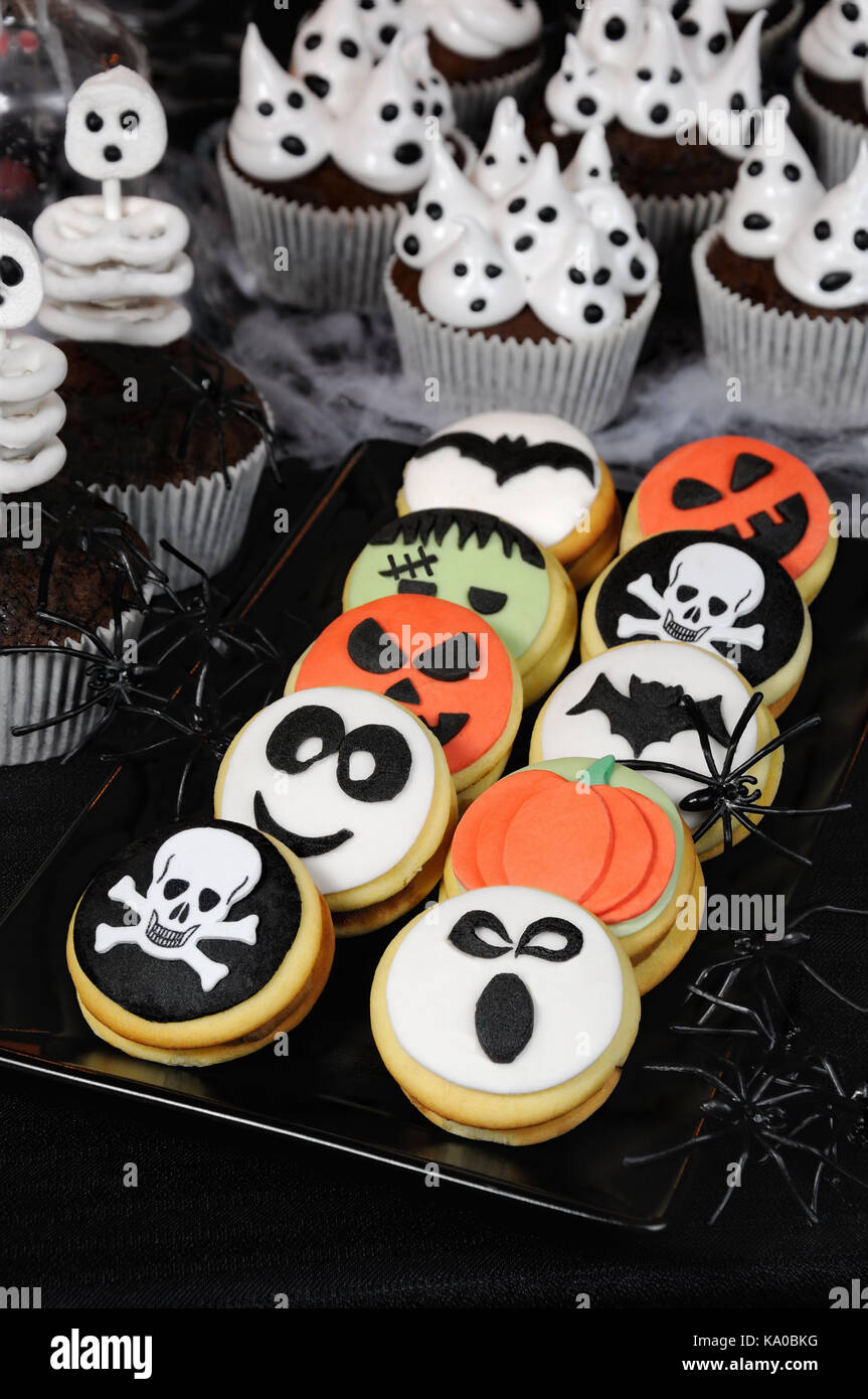 Halloween biscuits sandwich with colorful decorated with marzipan baked ...