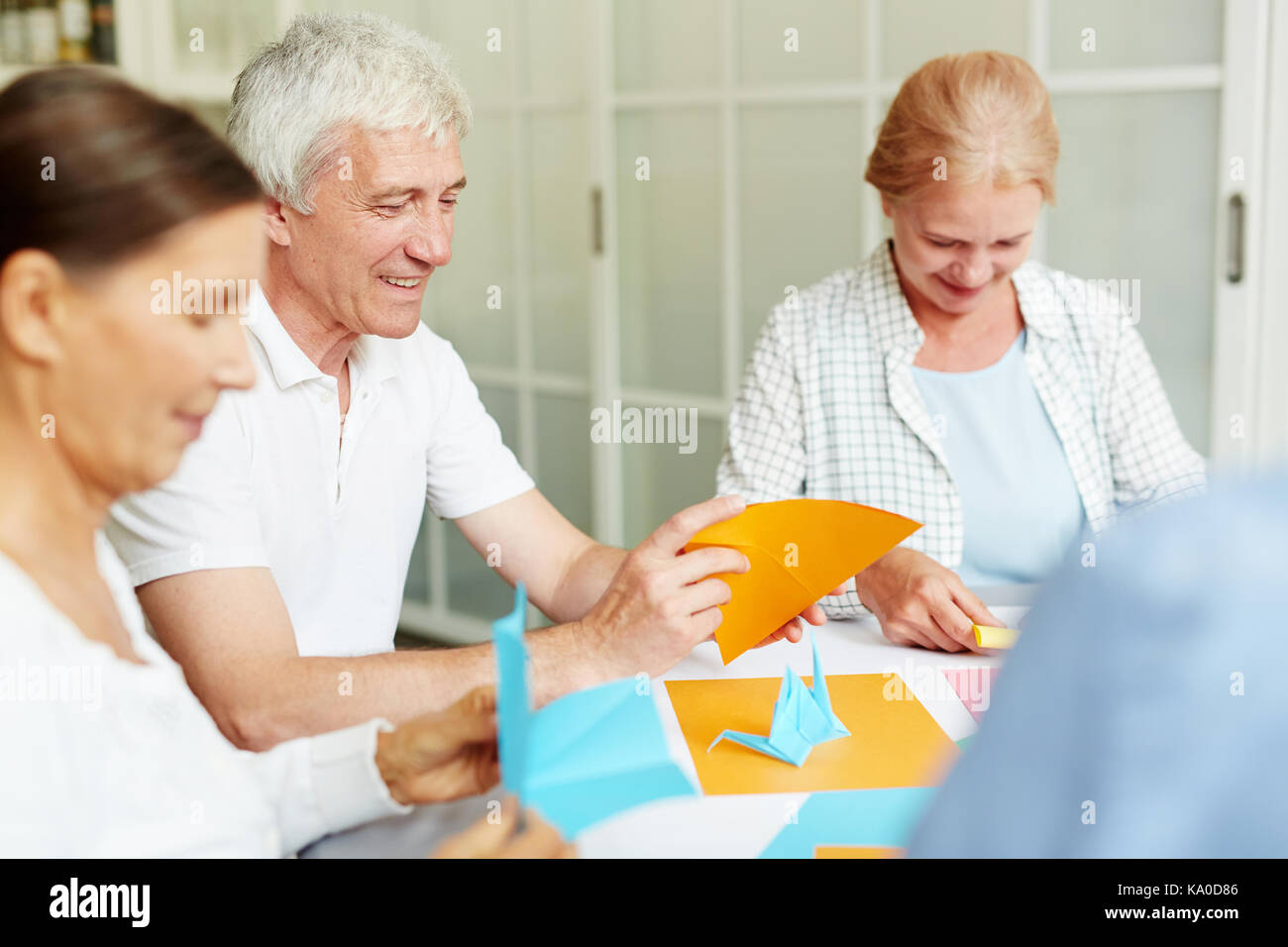 Woman folding paper origami hi-res stock photography and images - Alamy