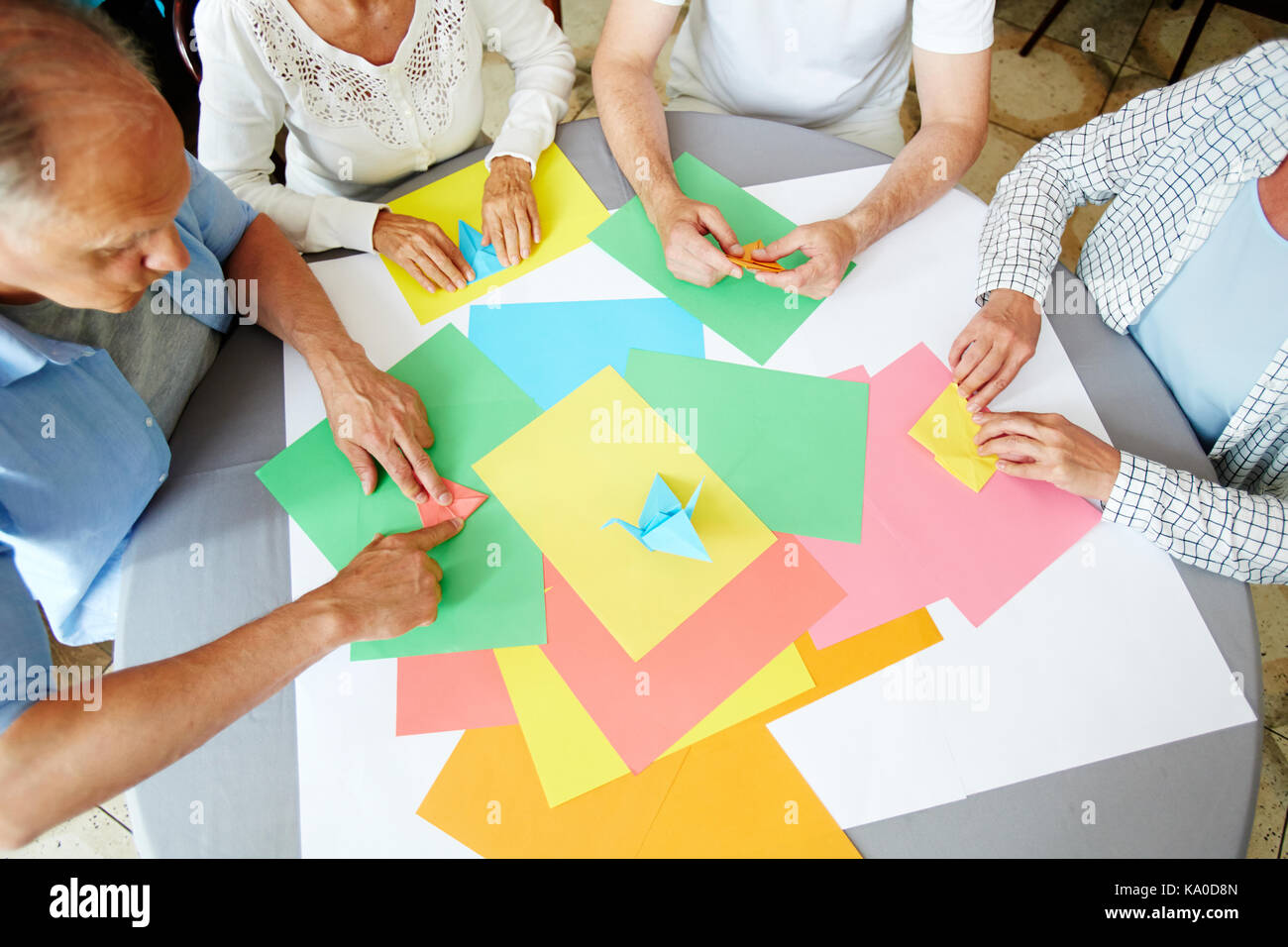 Woman folding paper origami hi-res stock photography and images - Alamy