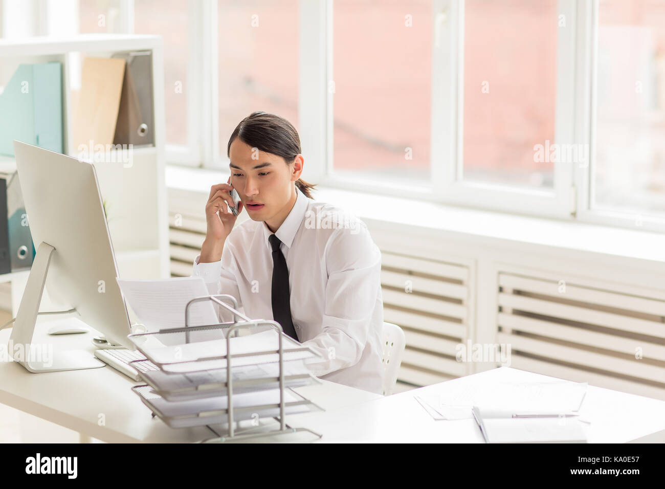 Young asian office worker hi-res stock photography and images - Alamy