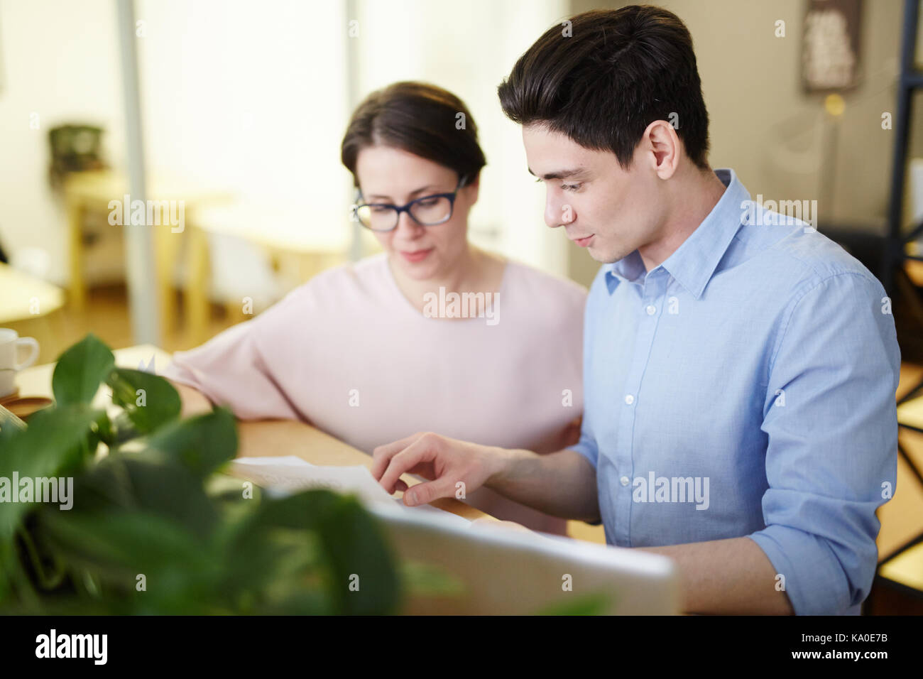Having Project Discussion with Colleague Stock Photo - Alamy