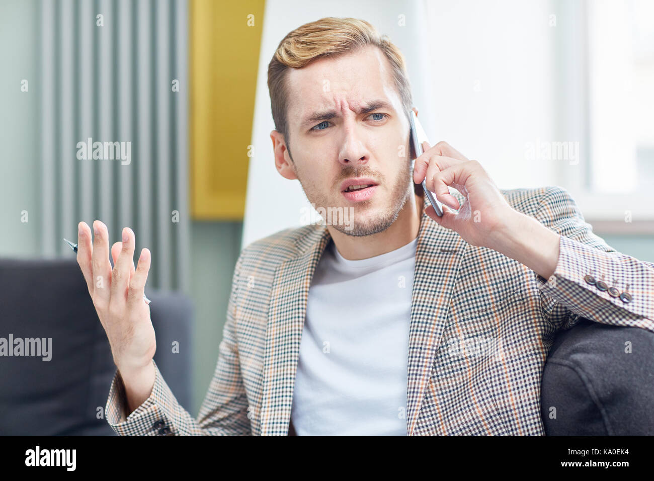 Having Tense Telephone Conversation Stock Photo - Alamy