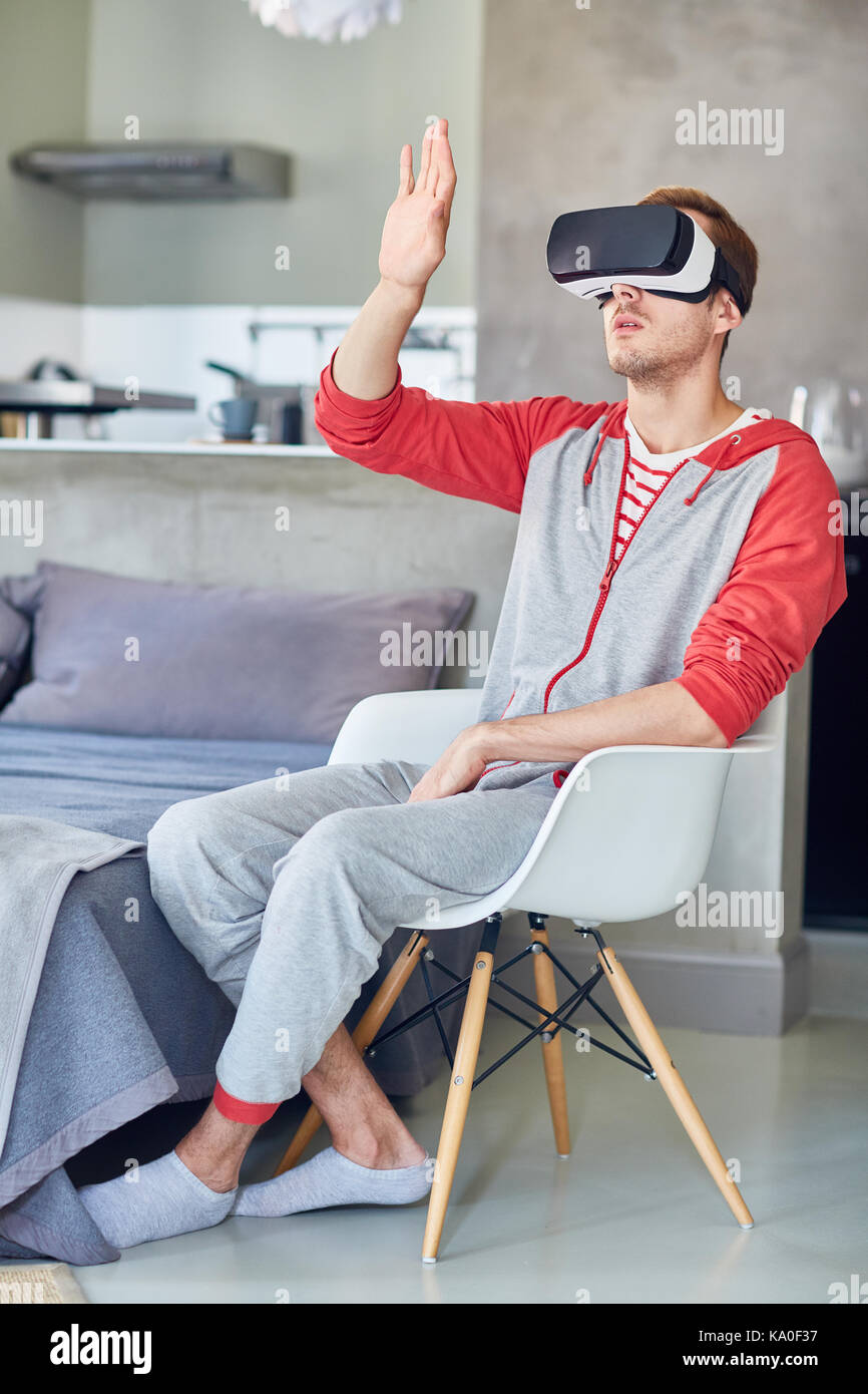 Man sitting using vr hi-res stock photography and images - Alamy