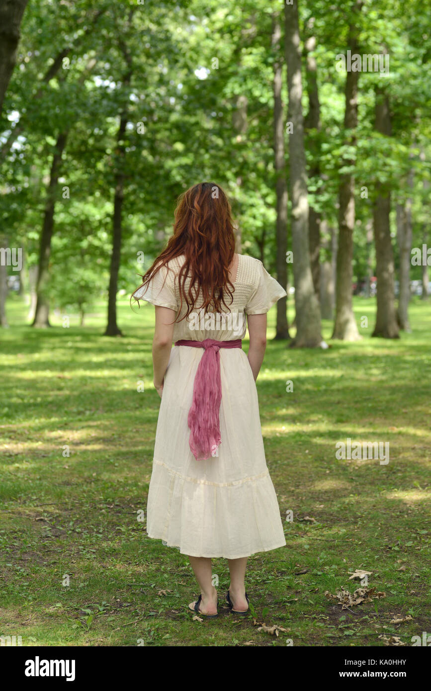 back of vintage woman in park Stock Photo - Alamy