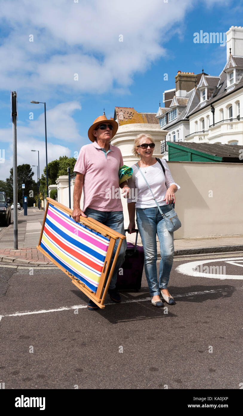 Holidaymakers in a seaside town walking to their hotel Stock Photo - Alamy