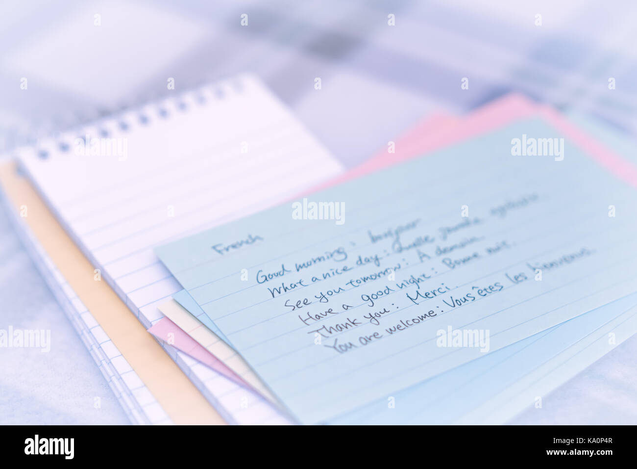 French; Learning New Language Writing Greetings on the Notebook Stock ...