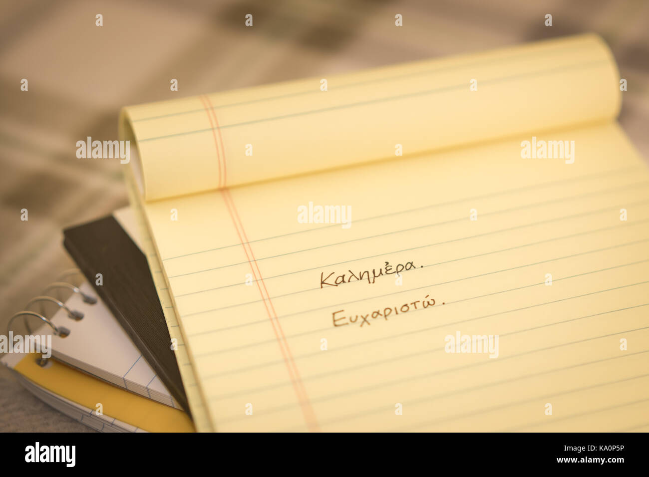 Greek; Learning New Language Writing Greetings on the Notebook ...