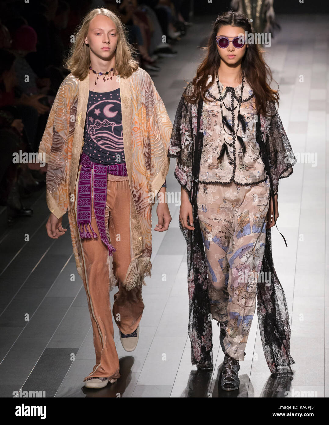 NEW YORK, NY - September 11, 2017: Aiden K and Yoon Young Bae walk the ...